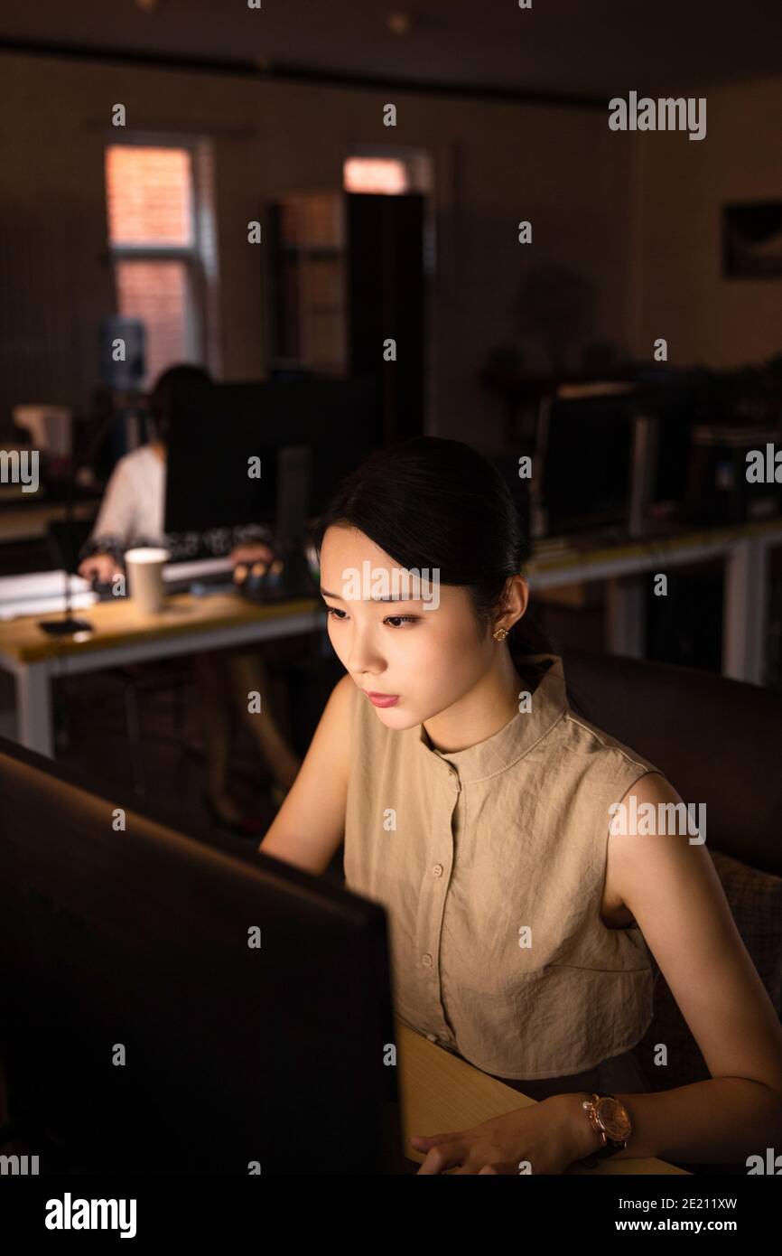 Business lady in the office to work overtime Stock Photo - Alamy