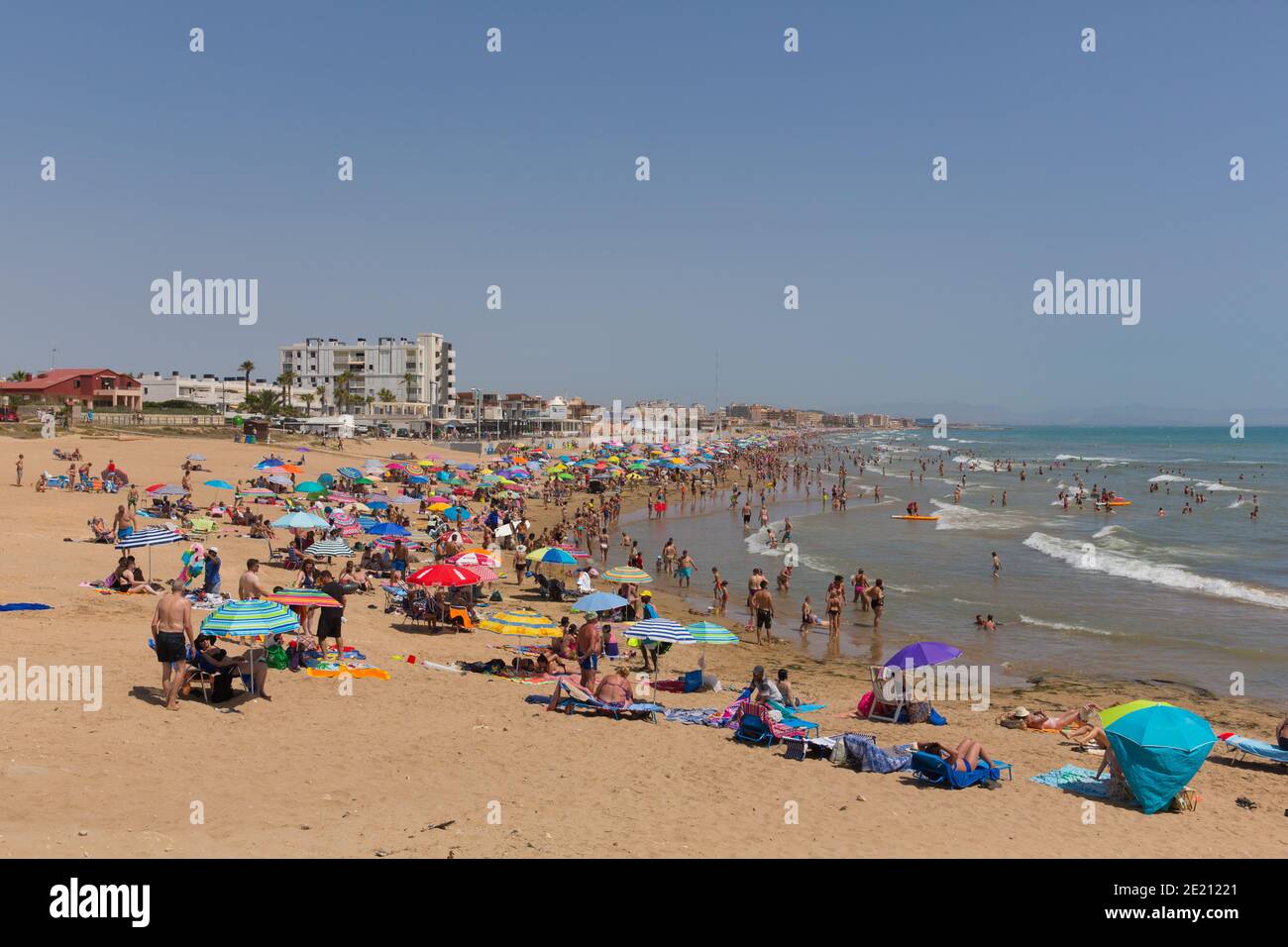 La Mata Spain near Torrevieja beach crowded with people and umbrellas ...
