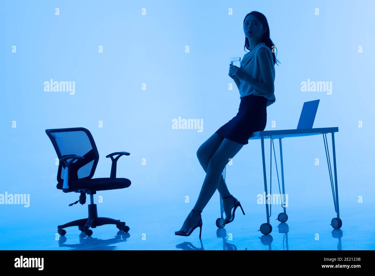 Busy business lady in the office Stock Photo - Alamy