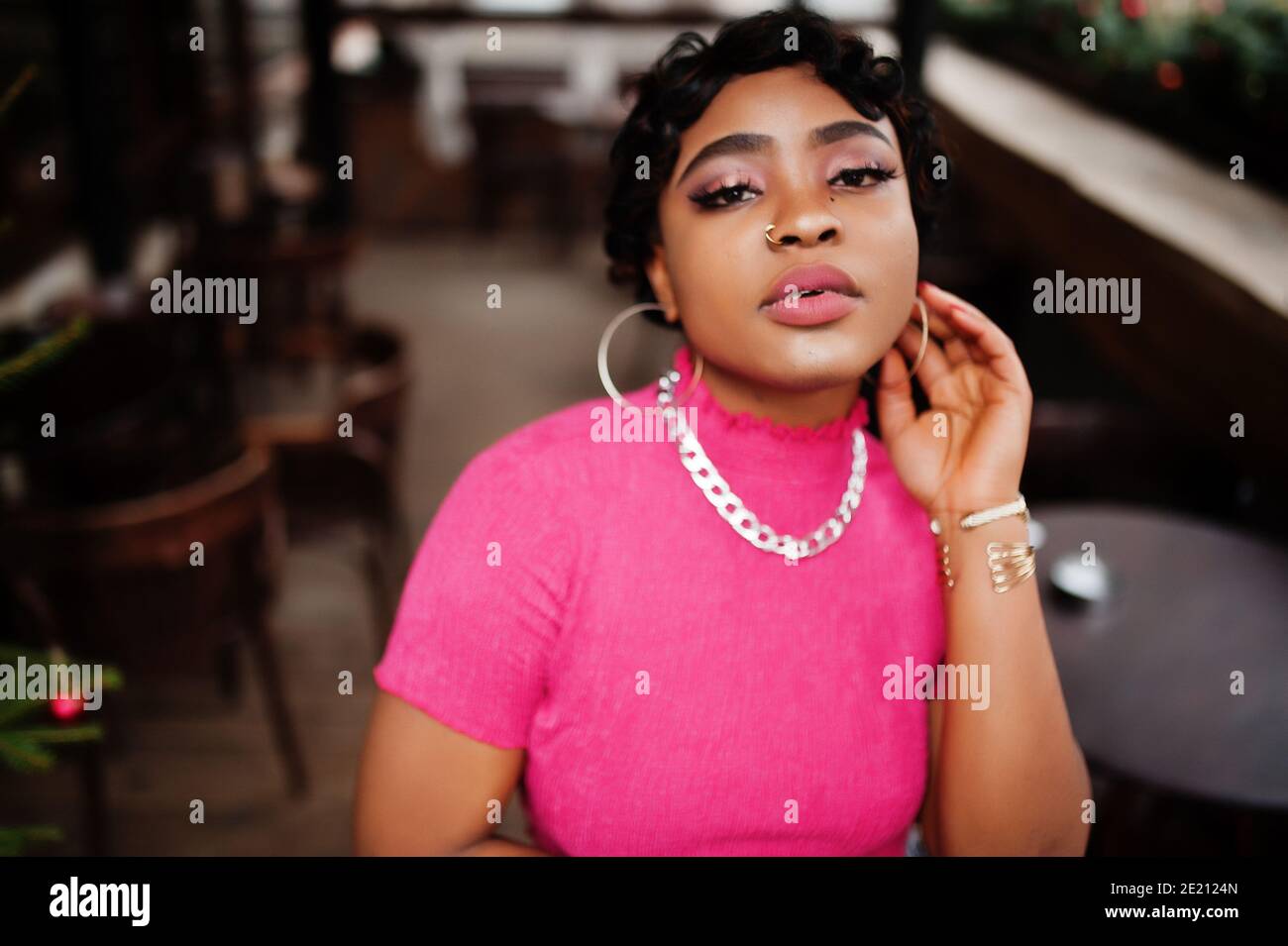 Urban young african american woman in pink top. Afro fashion chic women ...