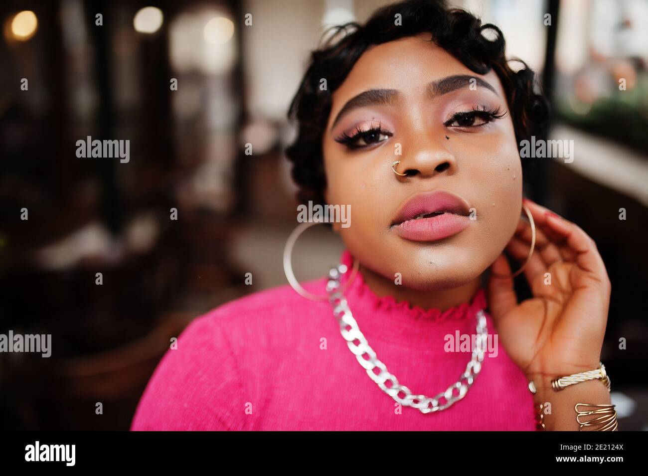 Urban young african american woman in pink top. Afro fashion chic women ...