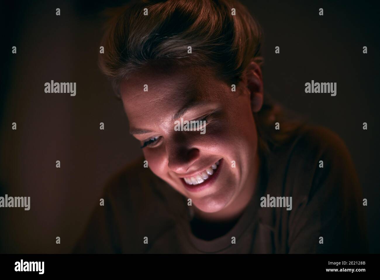 Woman lit by laptop screen hi-res stock photography and images - Alamy