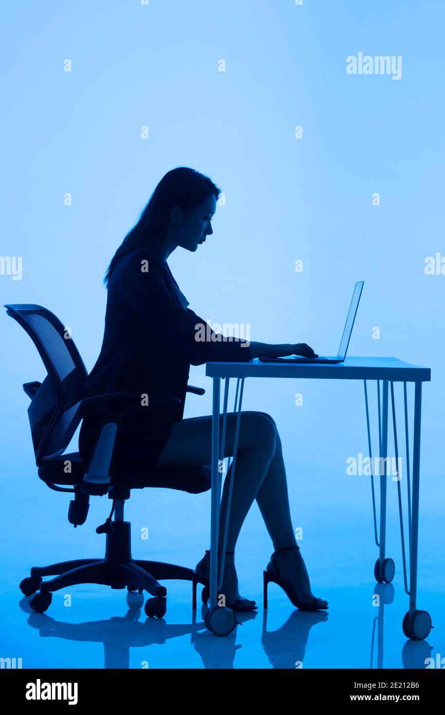 Busy business lady in the office Stock Photo - Alamy