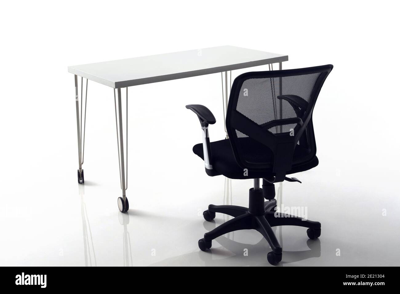 A desk and a chair in the office Stock Photo - Alamy