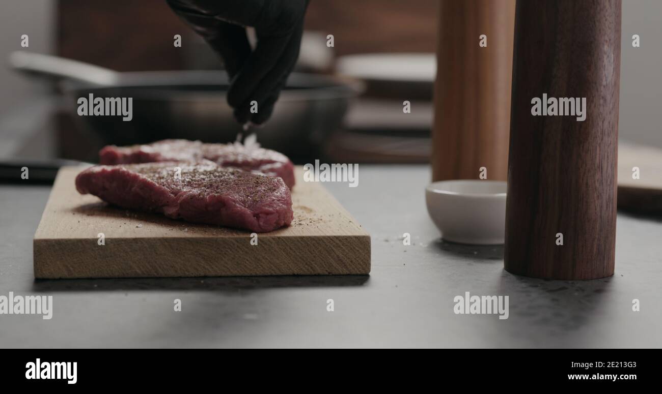 Restaurant kitchen chef salting piece hi-res stock photography and ...