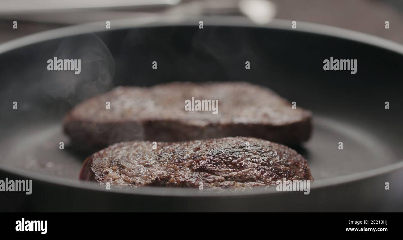 Two pieces steak on pan hi-res stock photography and images - Alamy