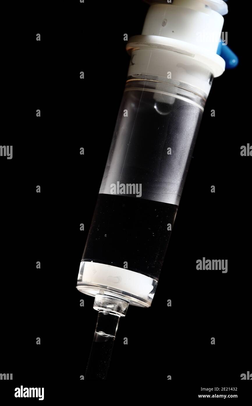 Medical dropper on the black background Stock Photo - Alamy