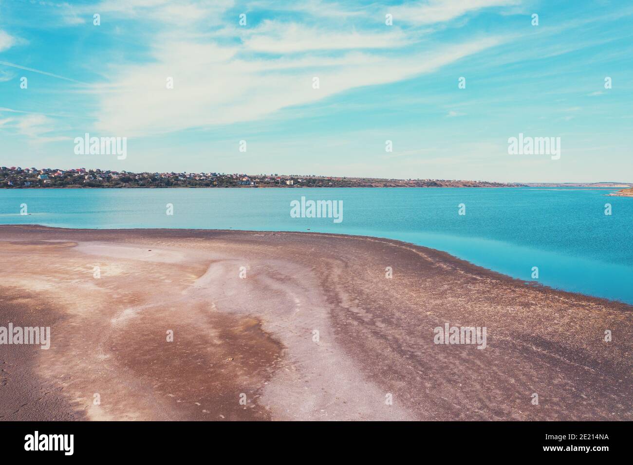 Landscape with lake and cloudy sky. View from above at lake and brown ...