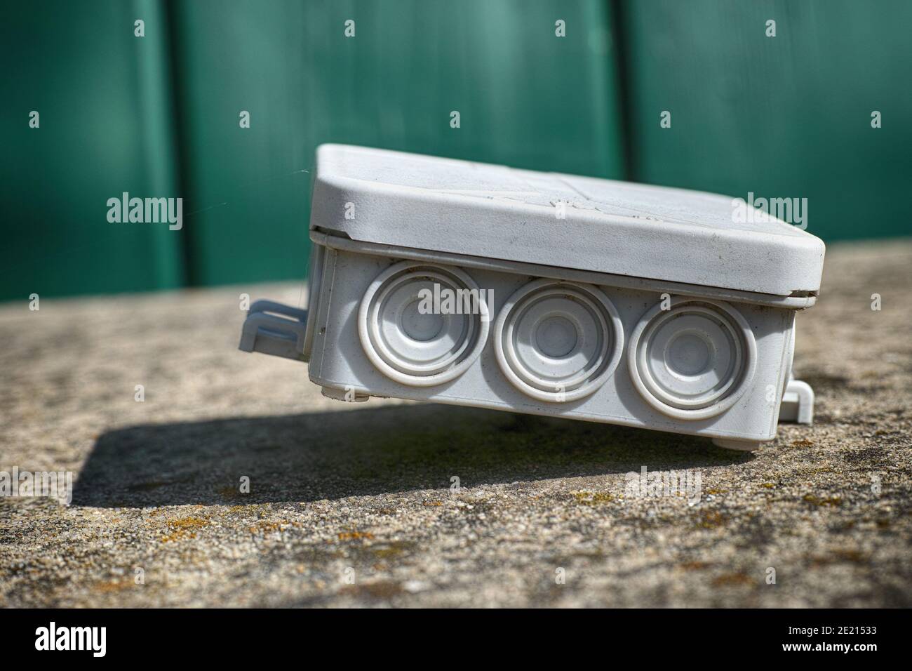 Electricity connector at a stone wall Stock Photo - Alamy
