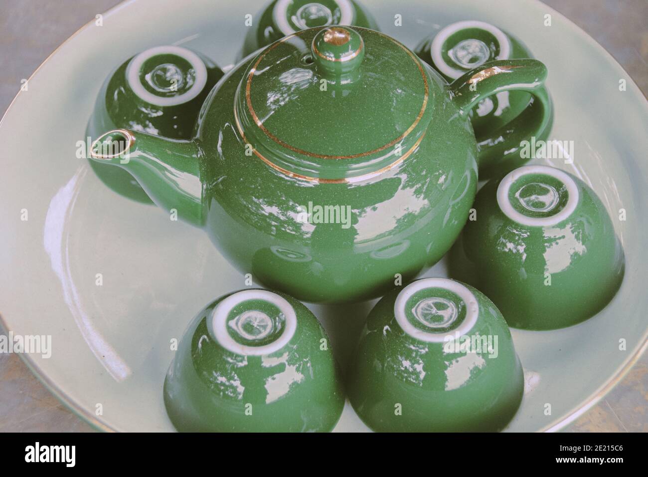 Closeup of a traditional, green ceramic tea set on a w Stock Photo - Alamy