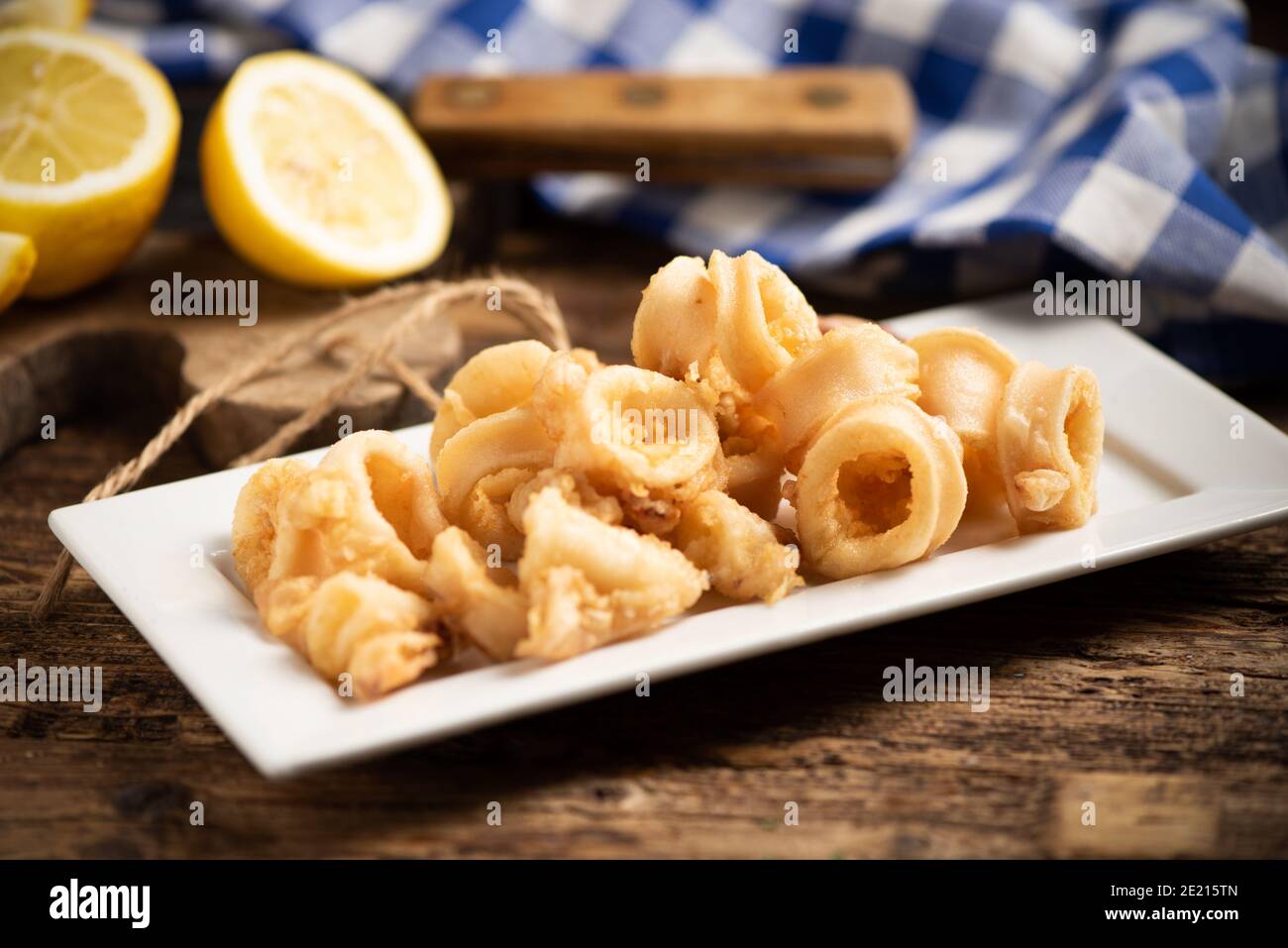 Traditional Italian fried calamari and lemon slice close up Stock Photo ...