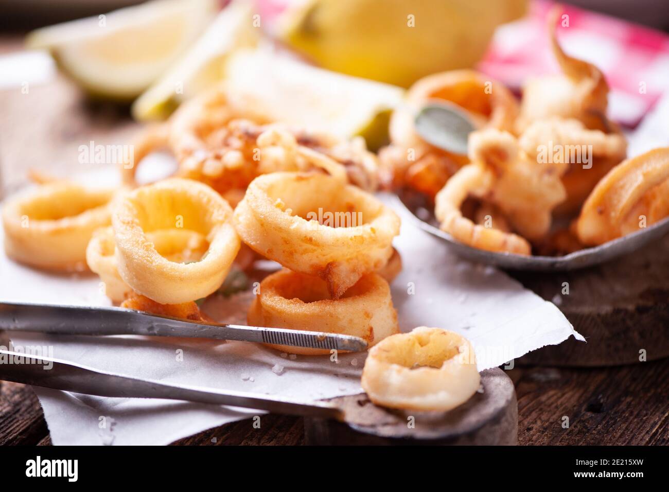 Traditional Italian fried calamari and lemon slice close up Stock Photo ...