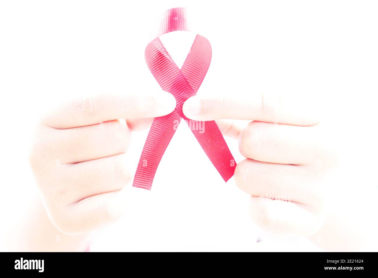 Human hand holding the red ribbon isolated over white background Stock ...