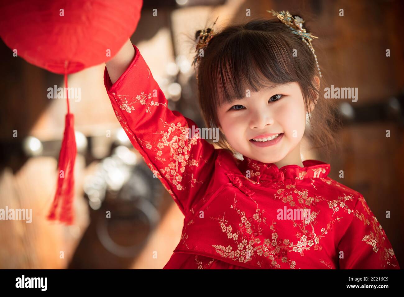 Cute girl with red lanterns Stock Photo - Alamy