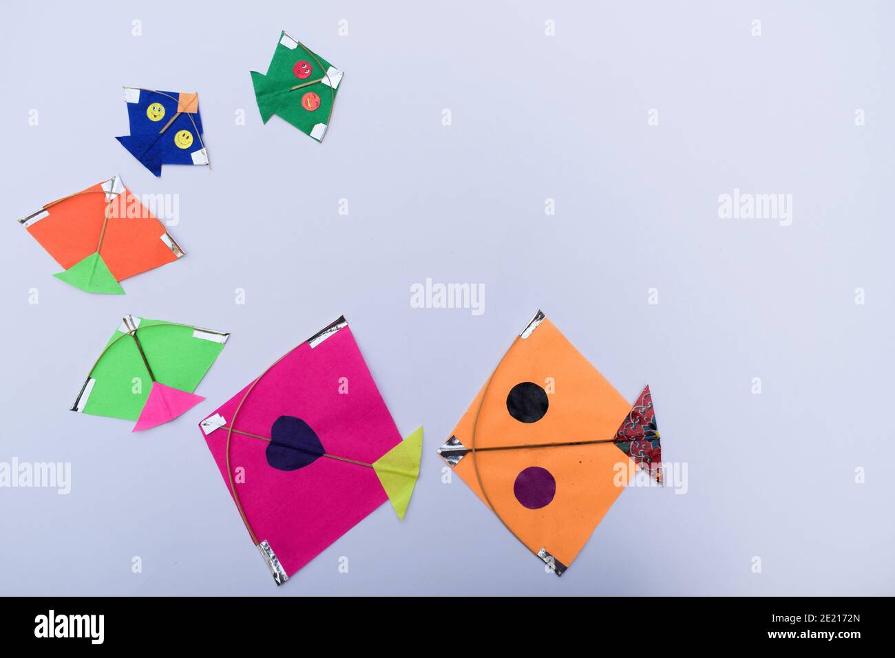 Miniature tiny kites with small spool of thread rolls, Patang with ...