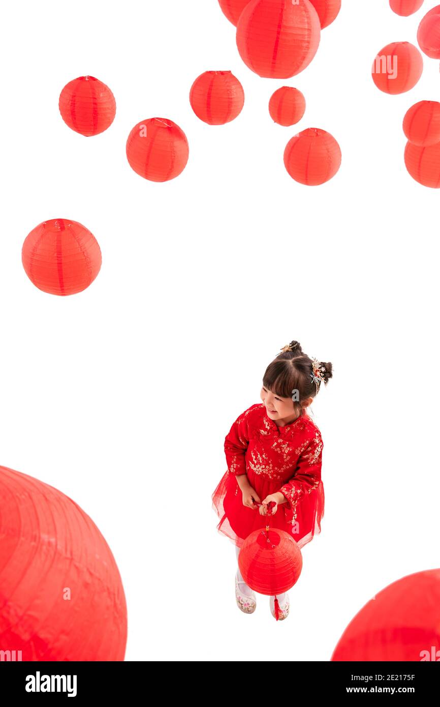 Under the red lanterns play little girl carrying a lantern Stock Photo ...