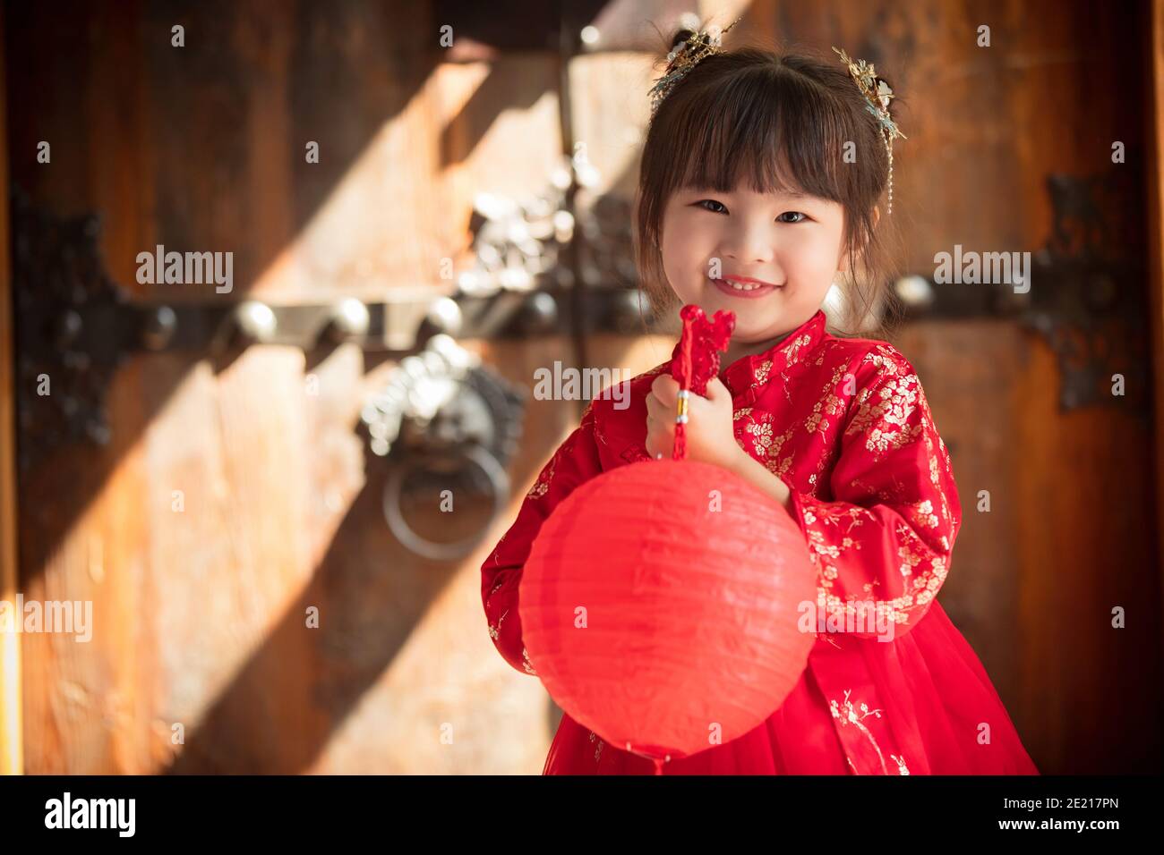 Cute girl with red lanterns Stock Photo - Alamy