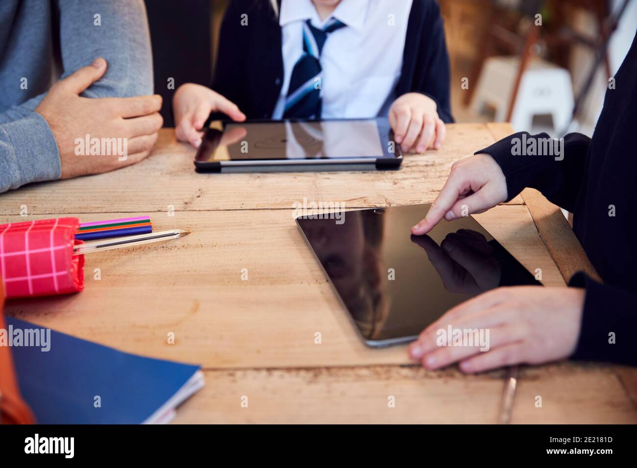 Close Up Of Father Helping Children Using Digital Tablets Wearing ...