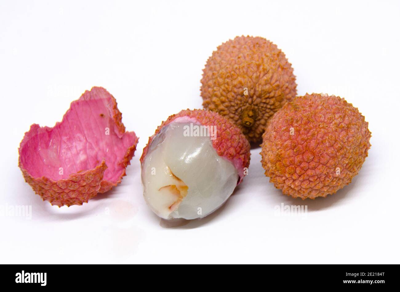 Close up of a group of lychees, a tropical fruit from Asia, isolated on ...