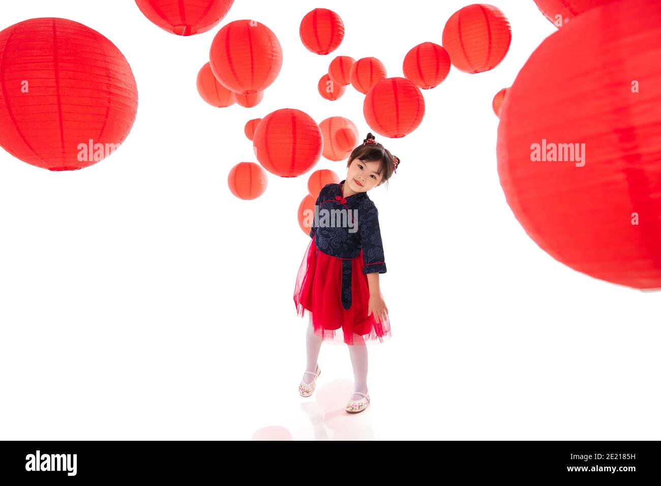 The pretty little girl under the red lanterns Stock Photo - Alamy