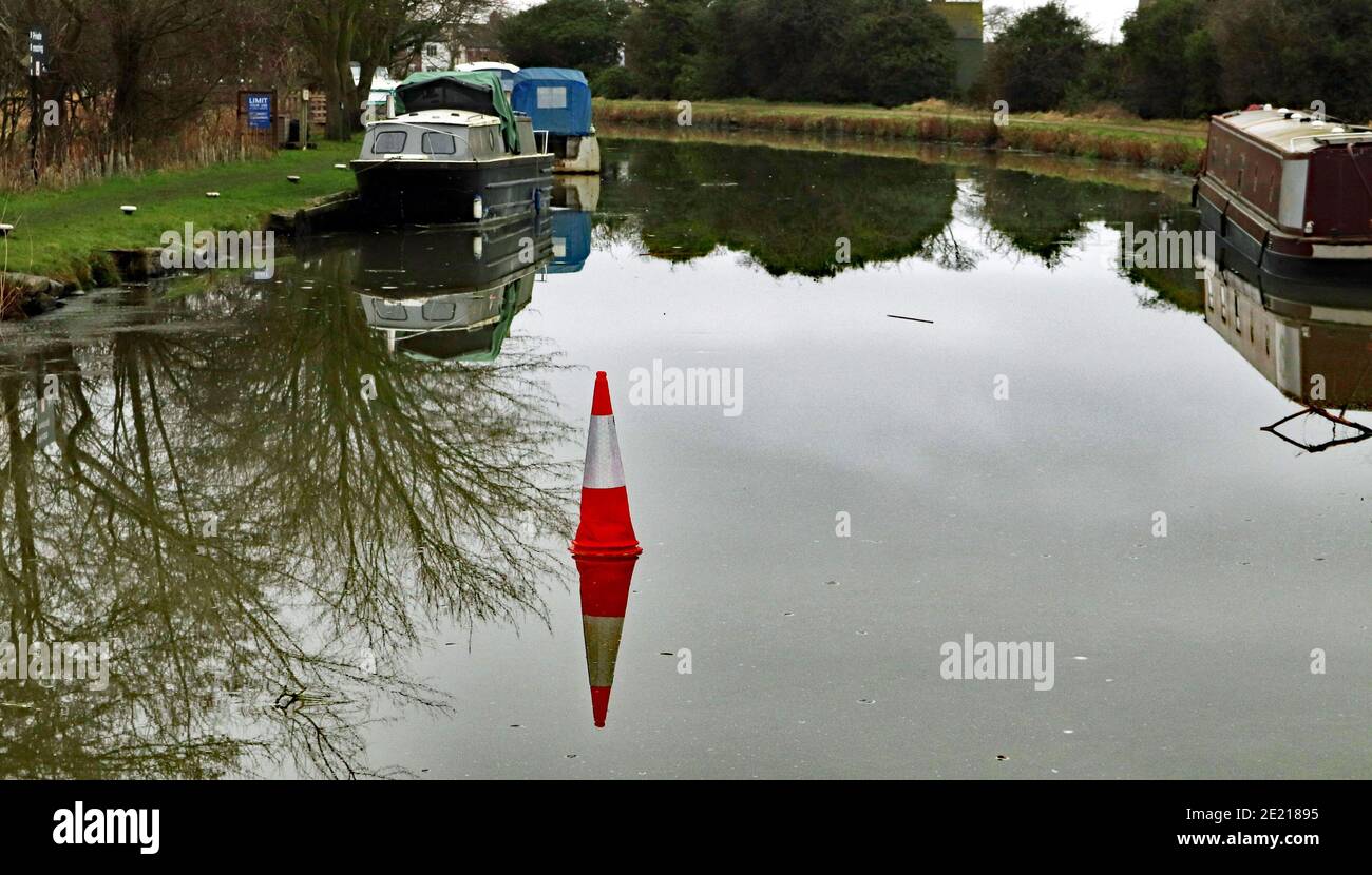 Traffic cone stood on a frozen canal hi-res stock photography and ...