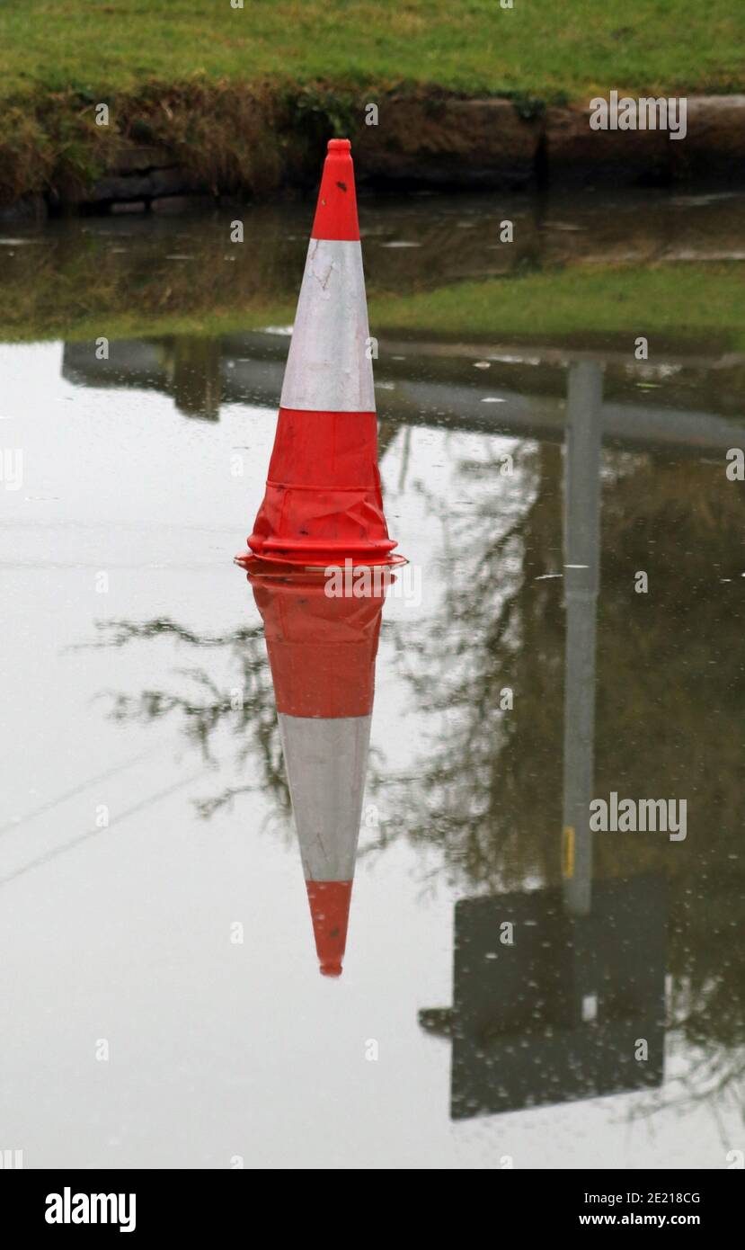 Traffic cone stood on a frozen canal hi-res stock photography and ...