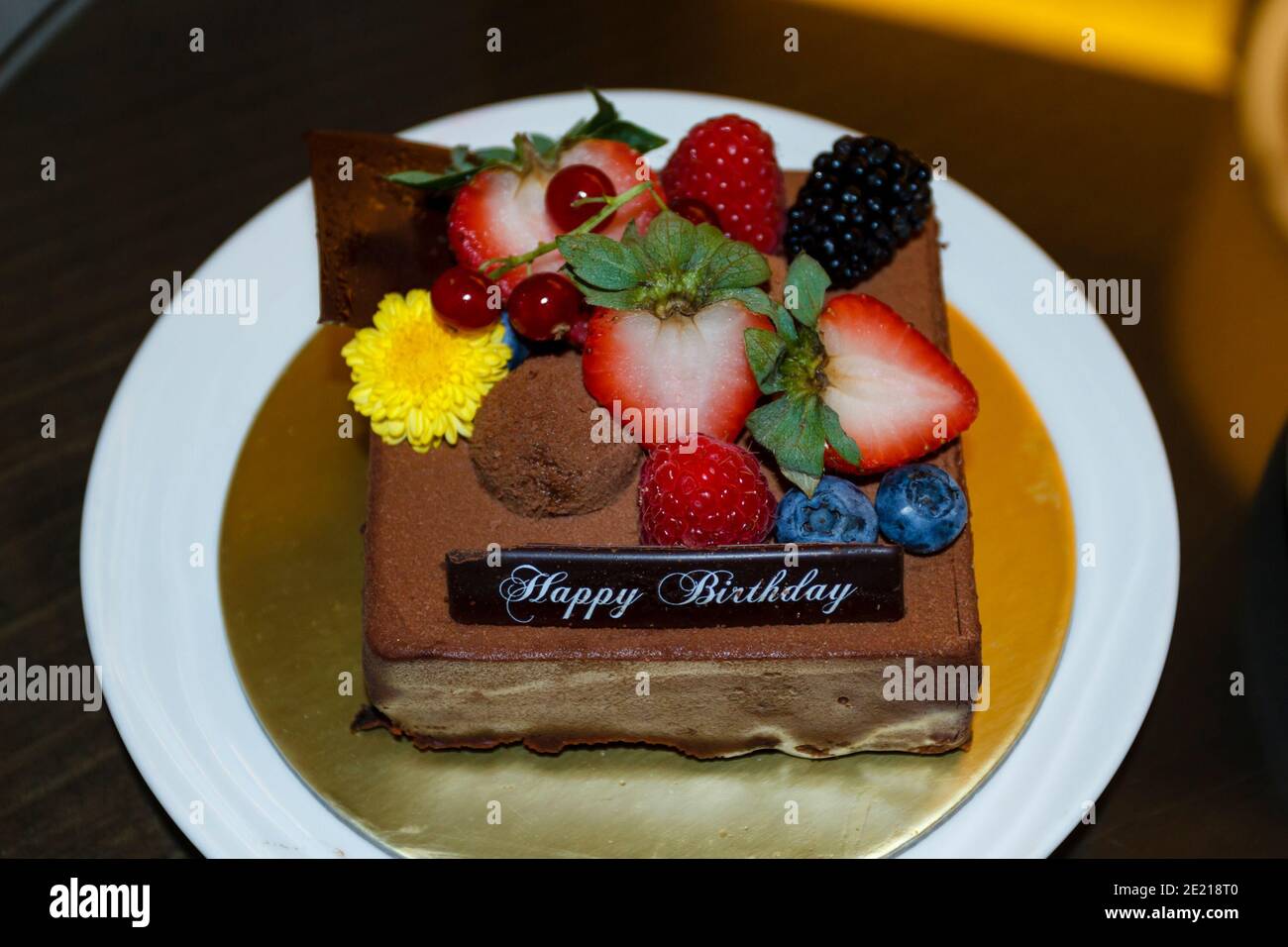Birthday cake with chocolate and fresh fruit Stock Photo - Alamy