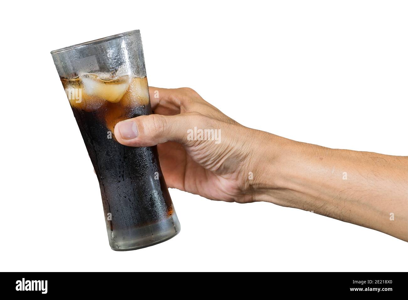 Hand of a man holding a cola glass with ices isolated on white ...