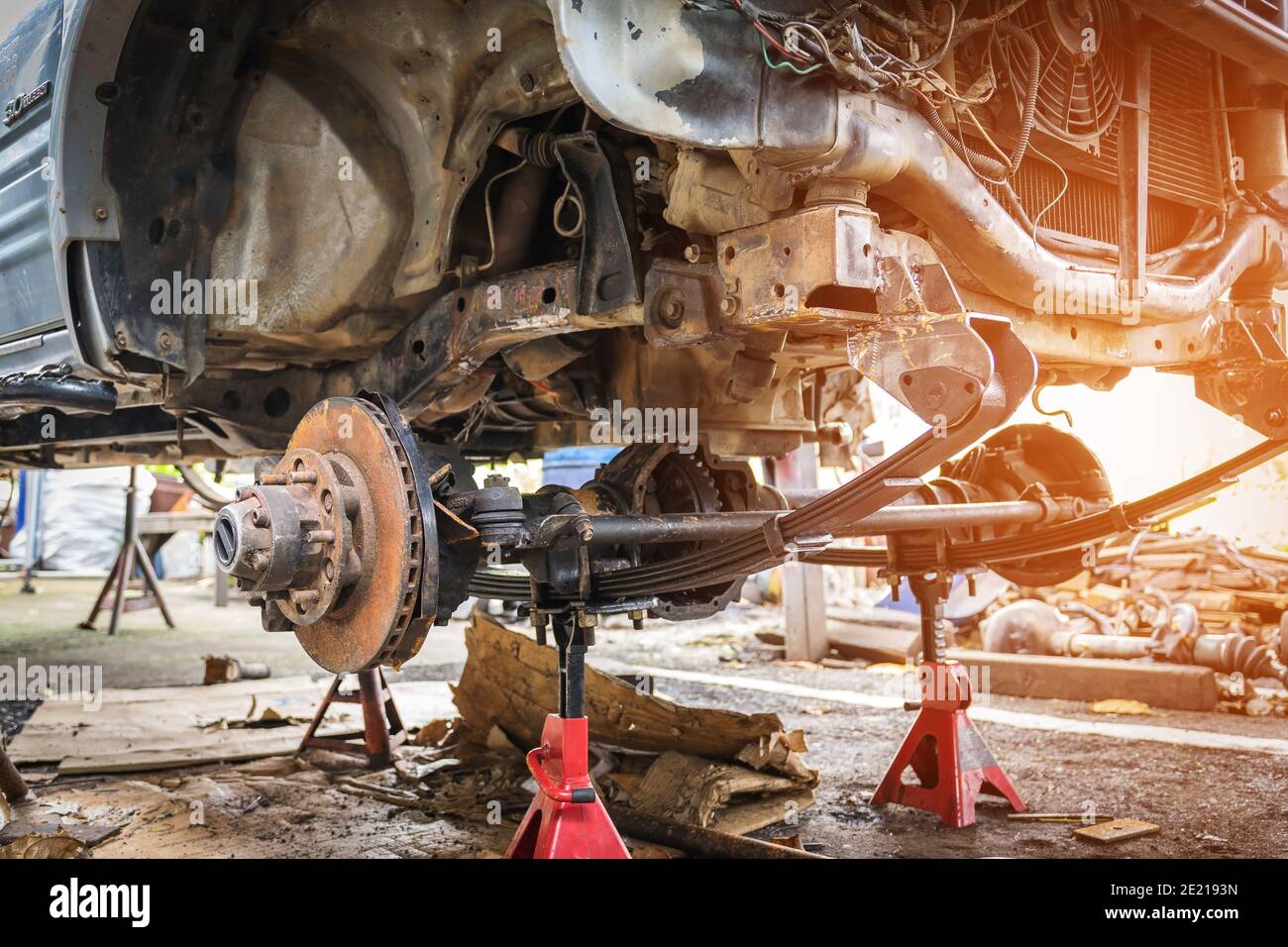 Old and rusty car's suspension, which removes the wheels for repair ...