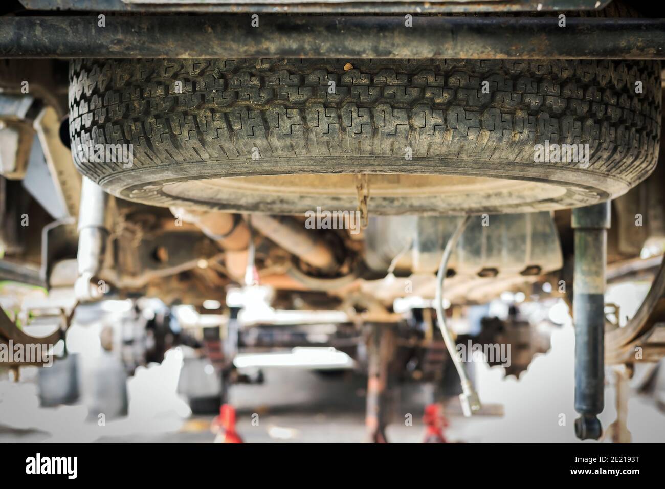 Rubber spare parts of the car under the belly of the car to change when ...