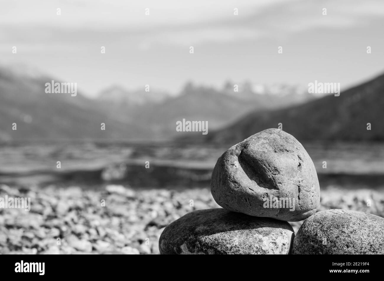 Grayscale closeup of stacked rocks on the rocky river Stock Photo - Alamy