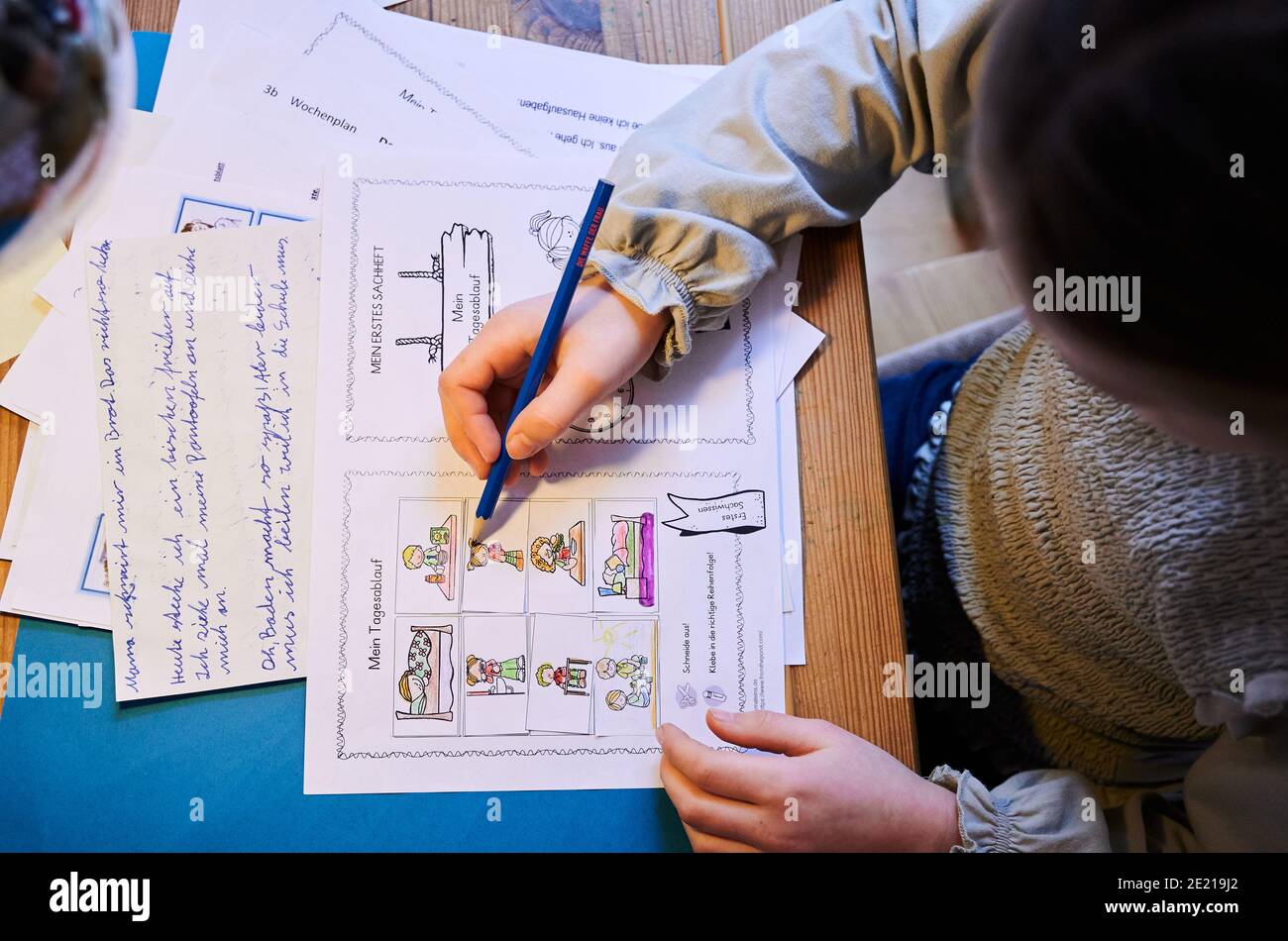 Berlin, Germany. 11th Jan, 2021. A 3rd grade student works at her desk ...