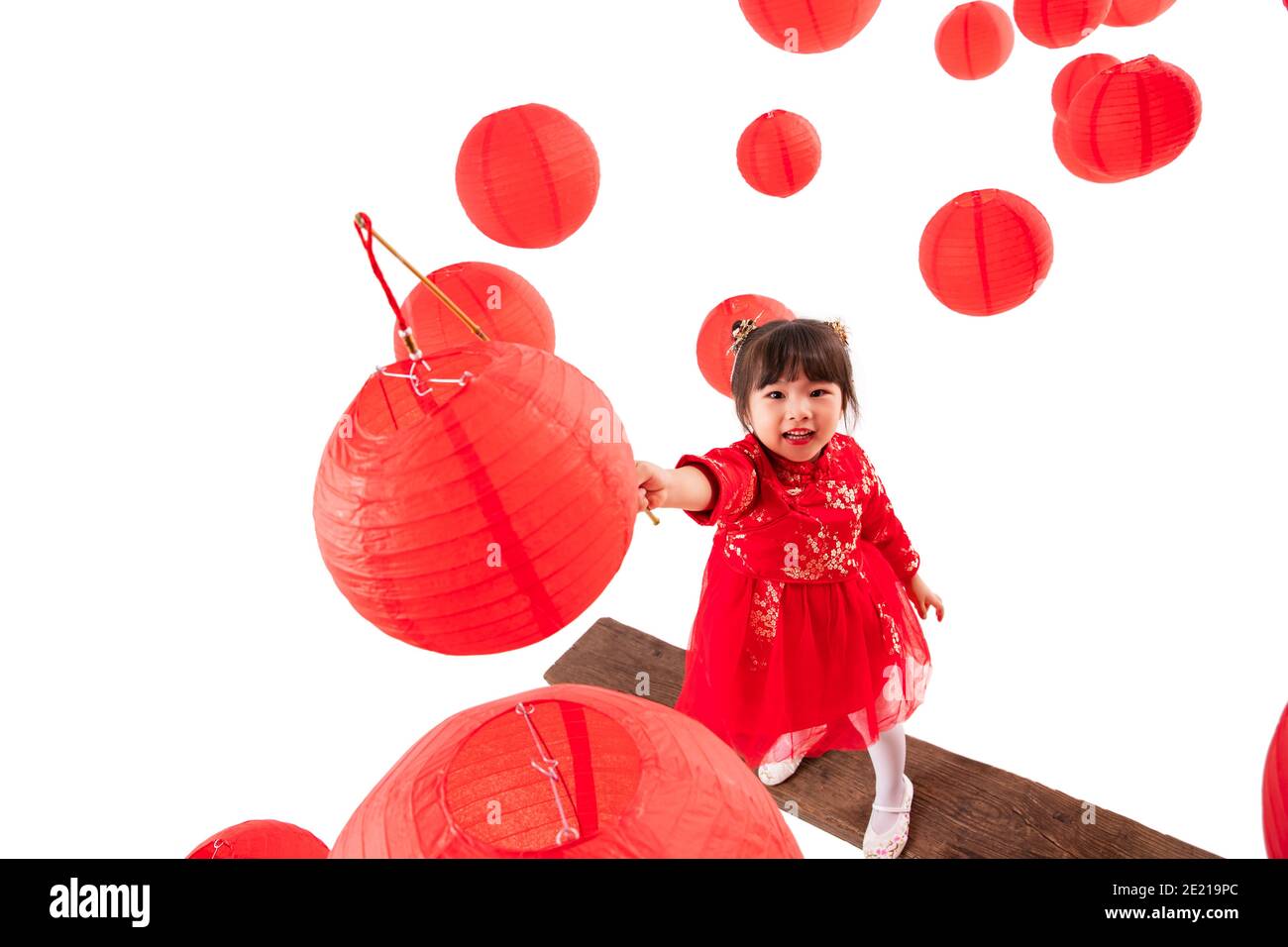 The little girl hung lanterns Stock Photo - Alamy