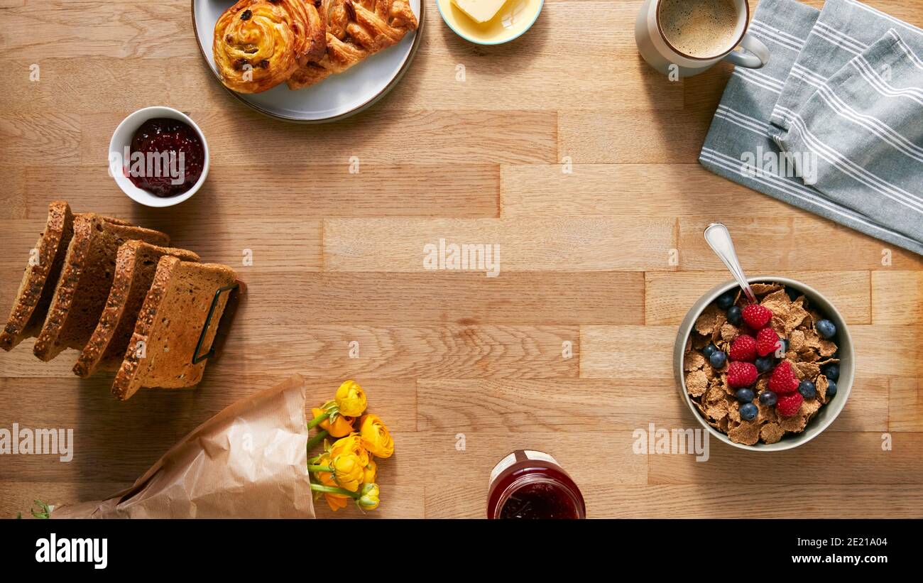 Overhead Flat Lay Shot Of Table Laid For Breakfast With Toast Cereal ...