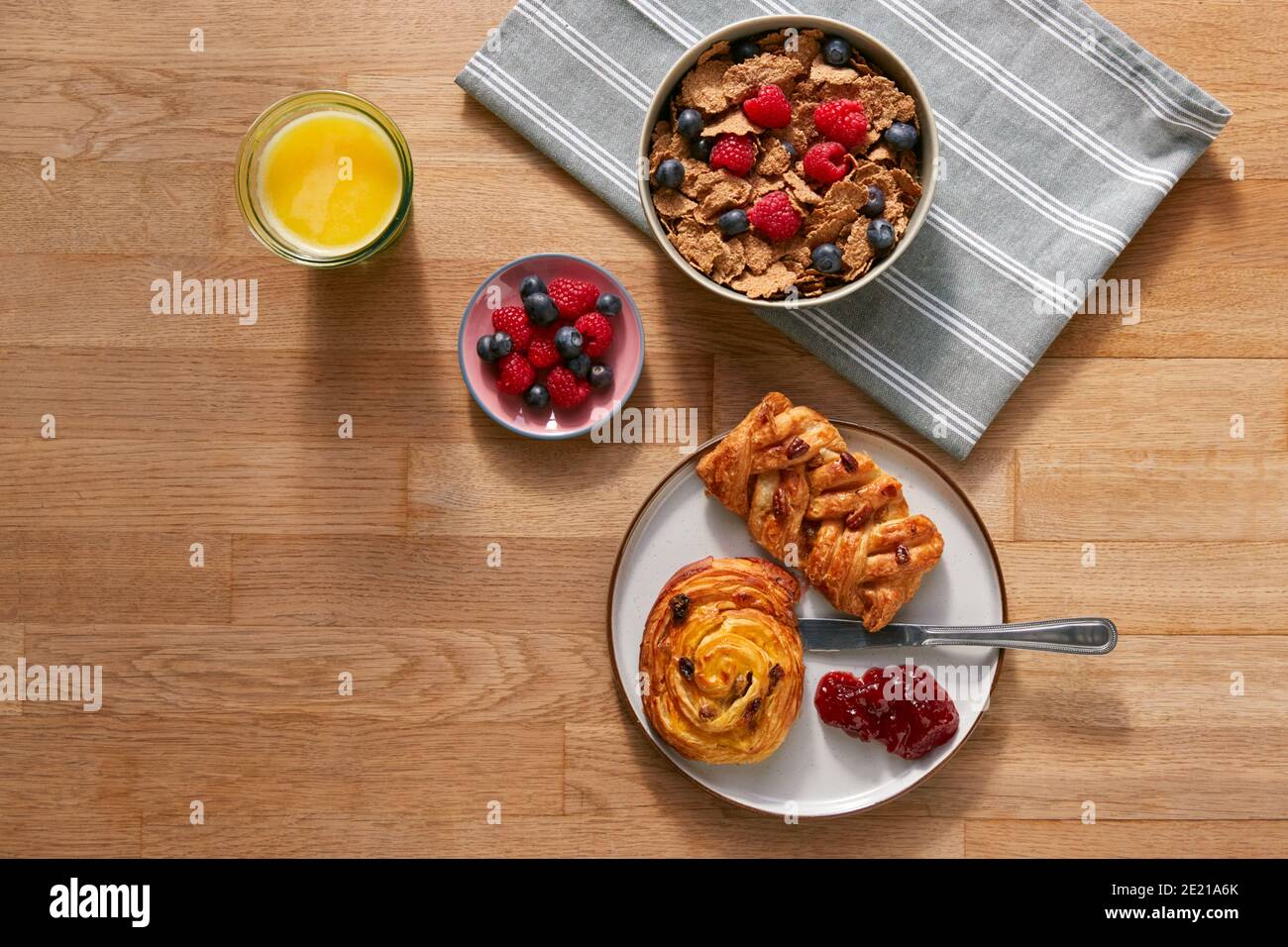 Overhead Flat Lay Shot Of Table Laid For Breakfast With Cereal Pastries ...