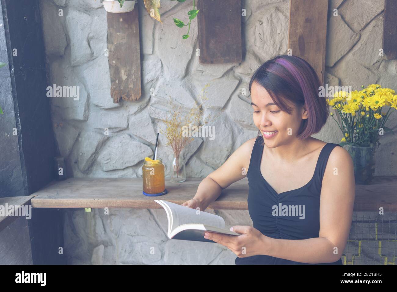 Happy girl reading good books Stock Photo - Alamy