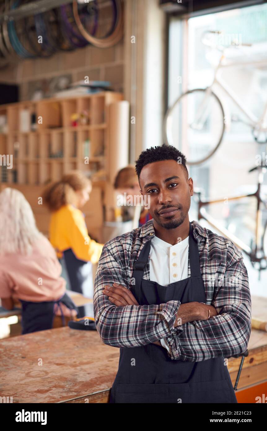 Portrait Of Small Business Owner In Workshop Assembling Hand Built ...