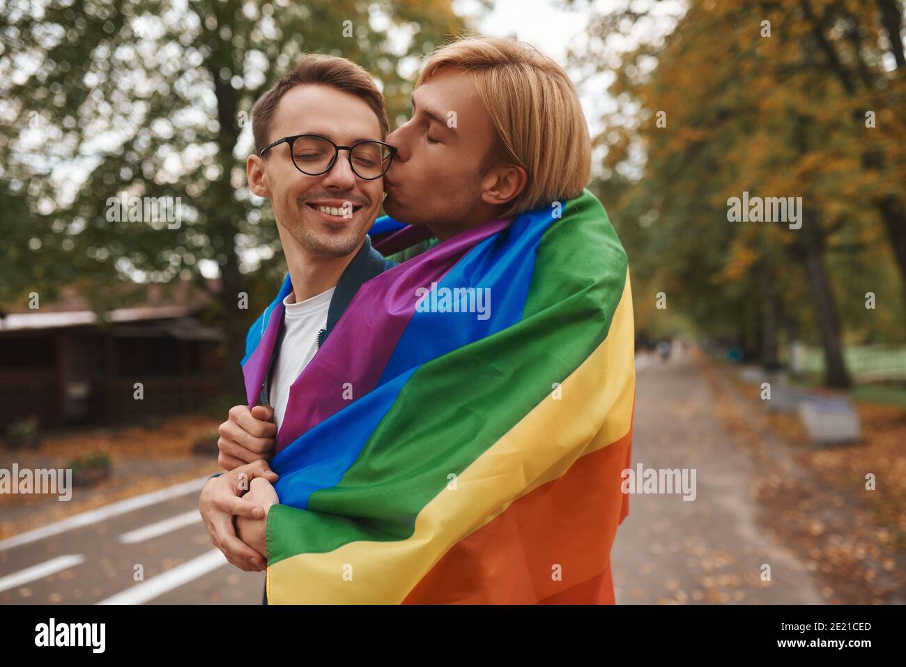 Romantic Gay Couple Hugging Kissing And Holding Hands Outdoors Two