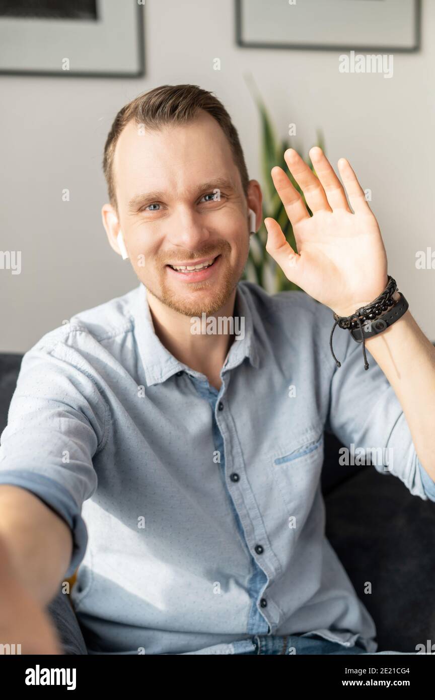 A video call with a happy guy Stock Photo - Alamy
