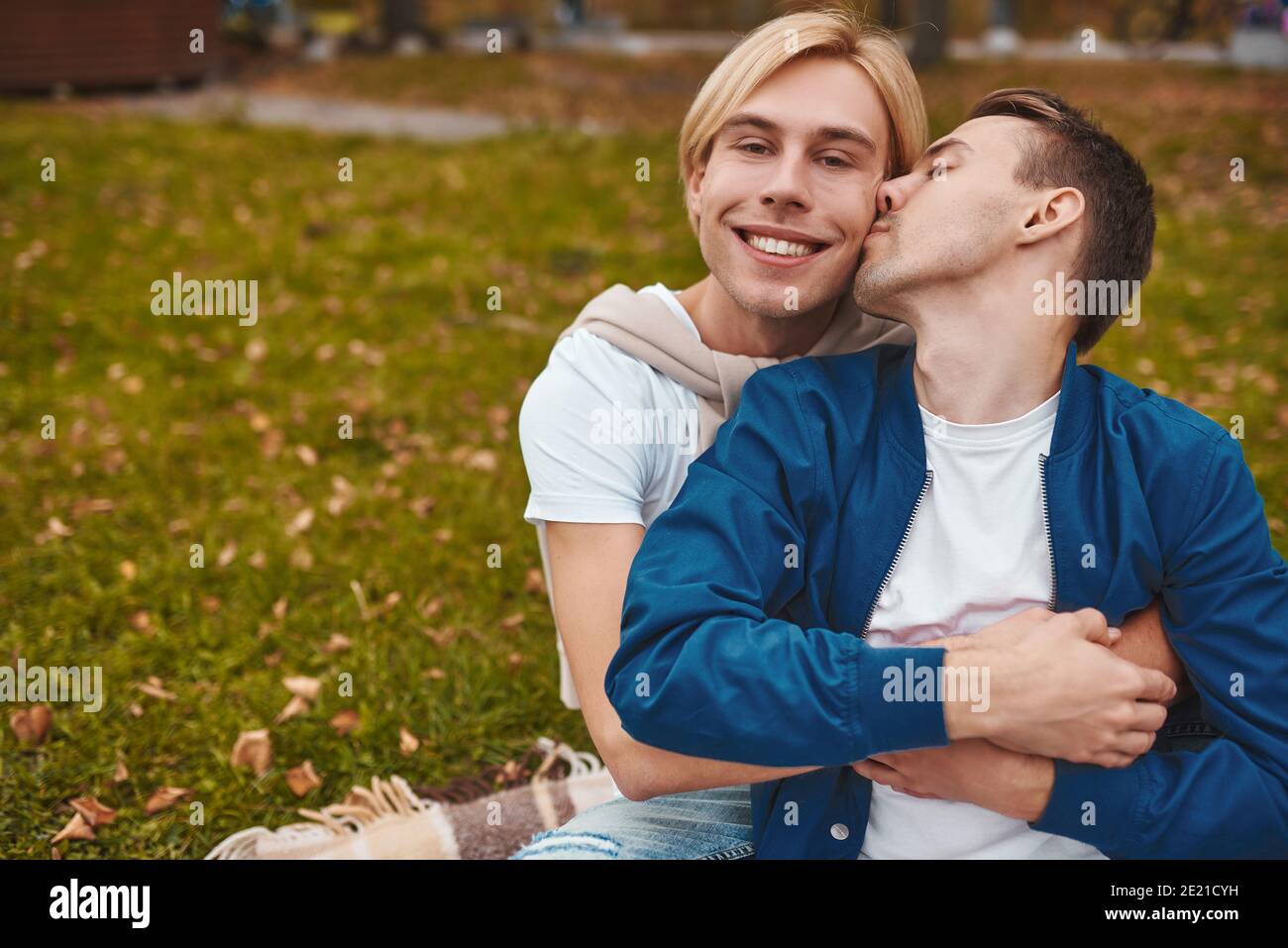 Loving gay couple having romantic date outdoors. Two handsome men ...