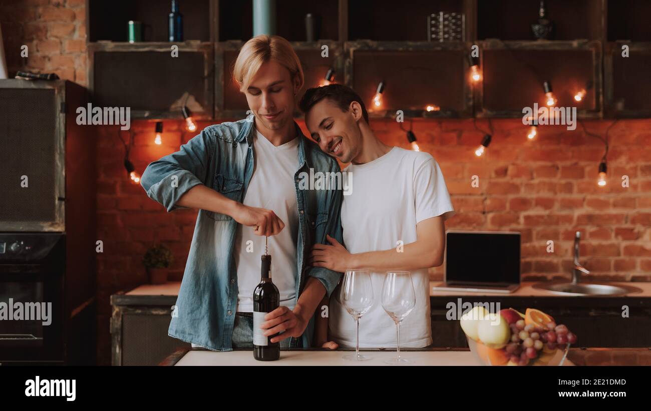 Happy gay couple cuddling on hi-res stock photography and images - Alamy