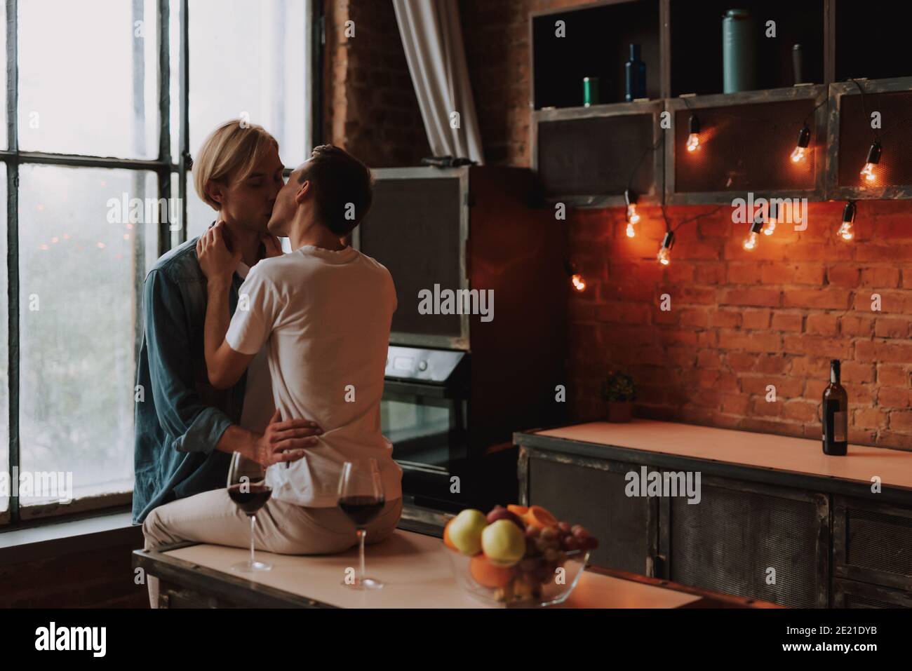 Happy gay couple cuddling on hi-res stock photography and images - Alamy