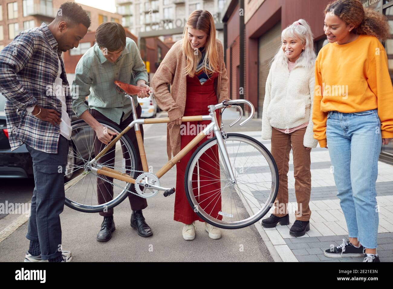 Group Of Multi-Cultural Friends On City Street Lifting Sustainable ...