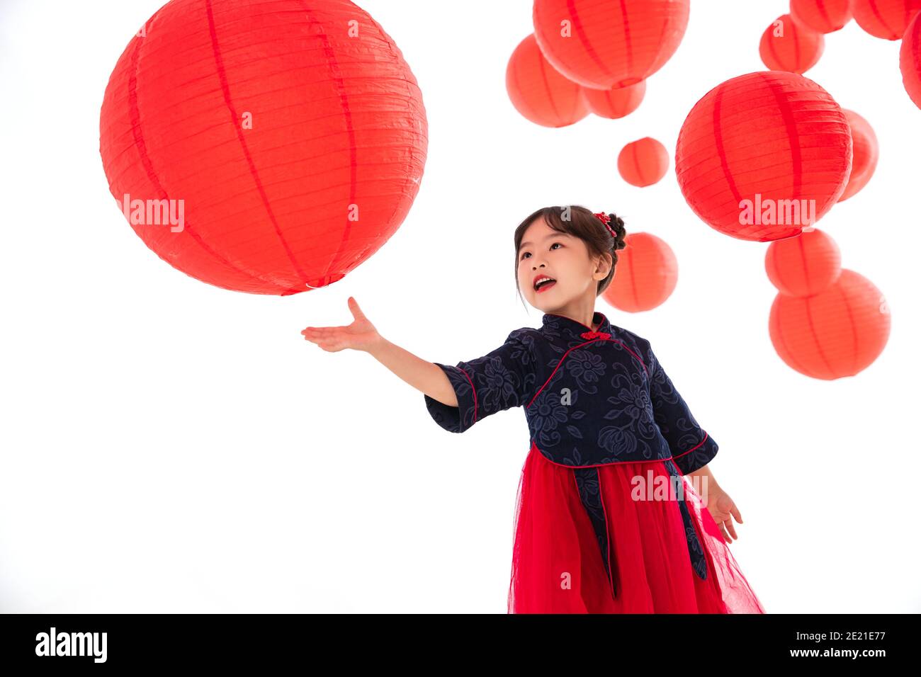 The little girl under the red lanterns Stock Photo - Alamy