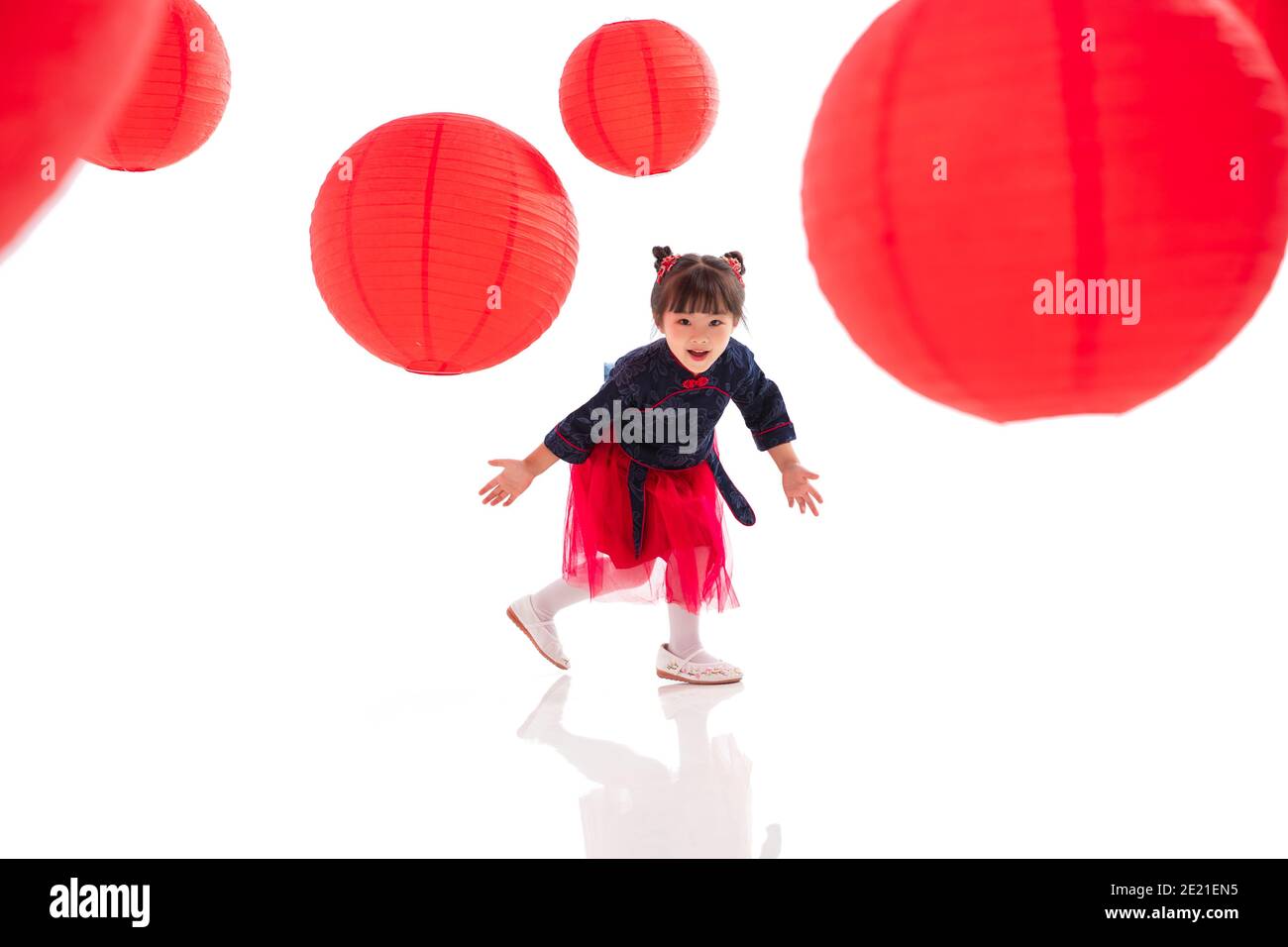 The cute girl under the red lanterns Stock Photo - Alamy