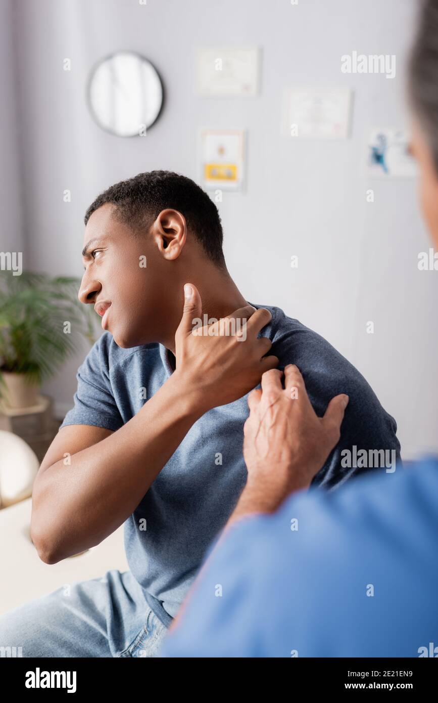 African doctor patient touch hi-res stock photography and images - Alamy