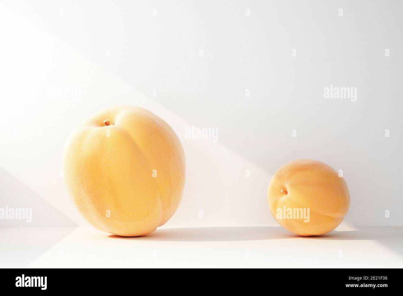 comparison of small and large peach in a ray of light. 3d rendering ...