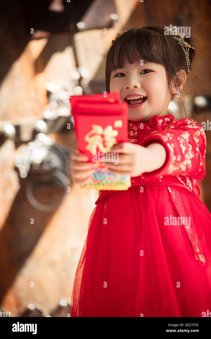 Cute girl with a red envelope Stock Photo - Alamy