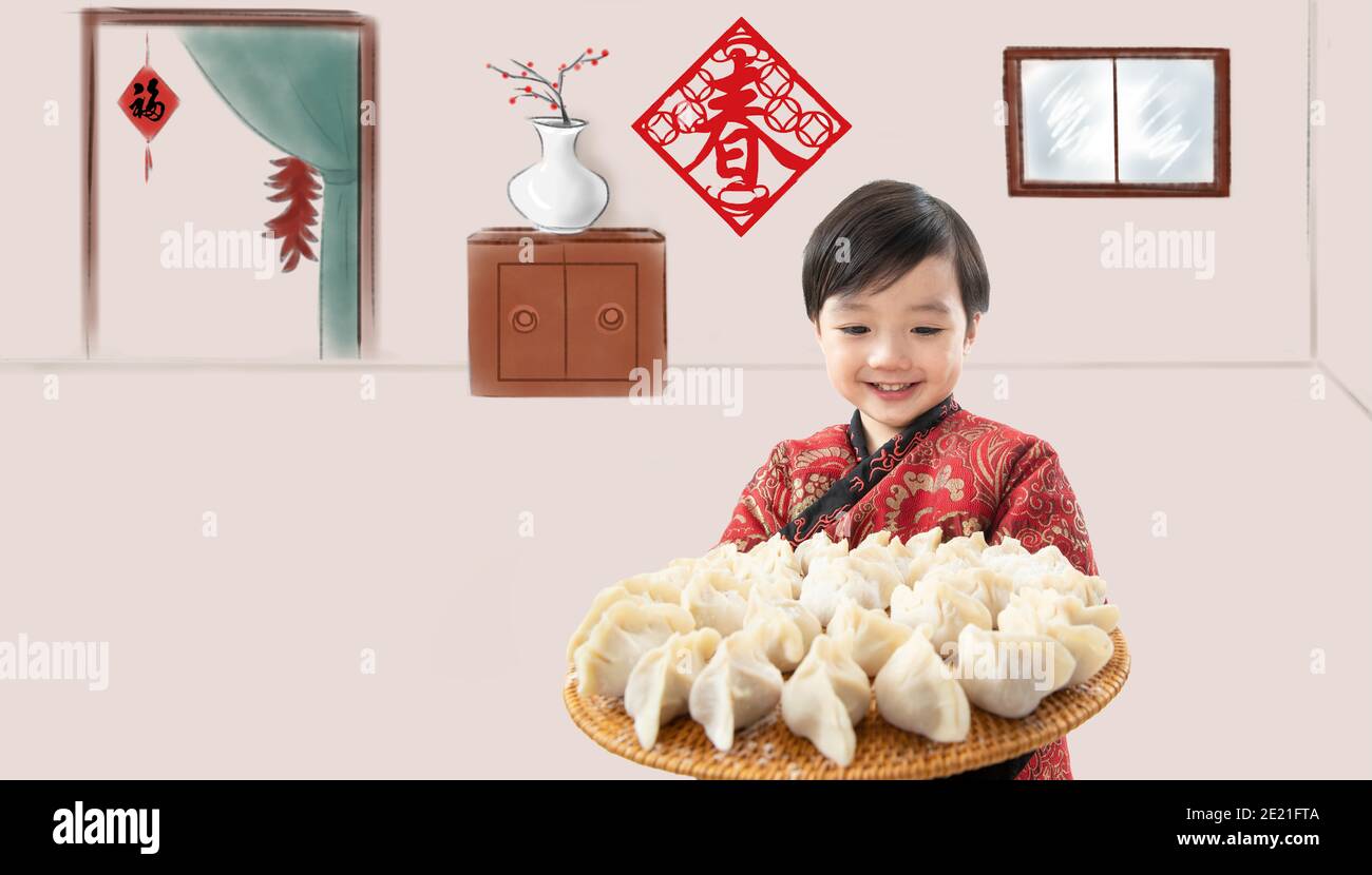 Happy boy with dumplings New Year in Stock Photo - Alamy