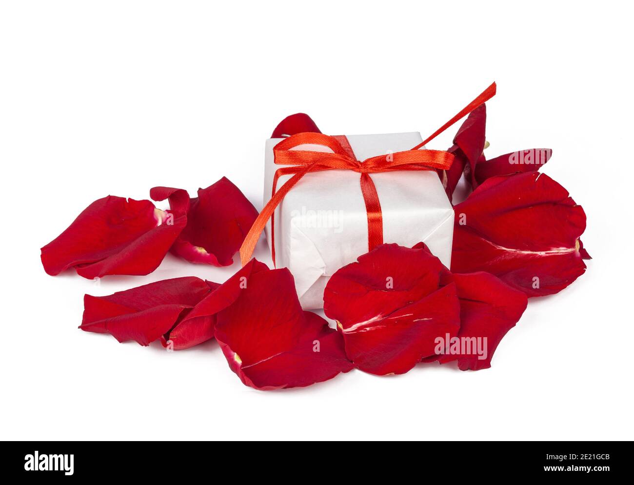 Gift box and rose petal on white background Stock Photo - Alamy